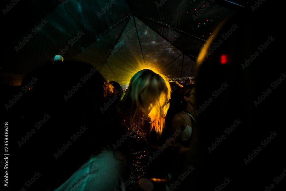 People inside a dark room with only a light shining from a lamp Stock ...