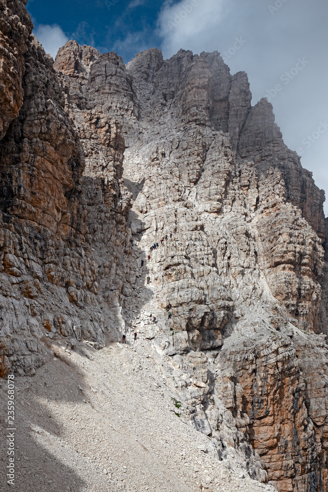 Mountaineers equipped face the "Bocchette Alte" ferrata in the Brenta ...