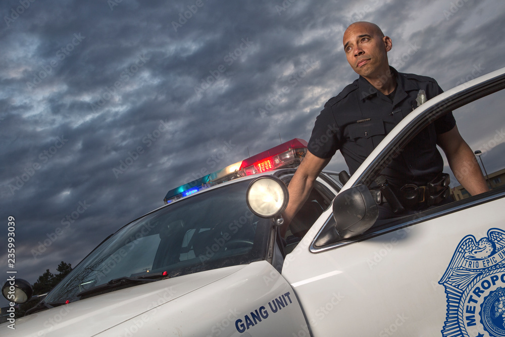 EMERGENCY SERVICES - Gang Unit Police Officer getting out of vehicle ...