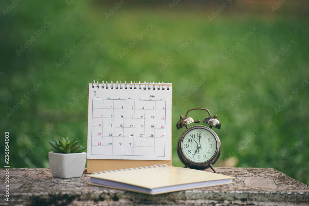 Desktop Calendar place on office desk. Calender and notebook for ...