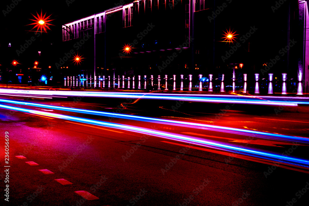 Cars light trails on a curved highway at night. Night traffic trails ...