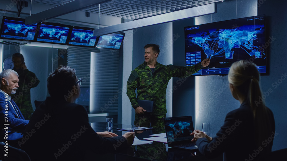 High-Ranking Military Man holds a Briefing to a Team of Government ...