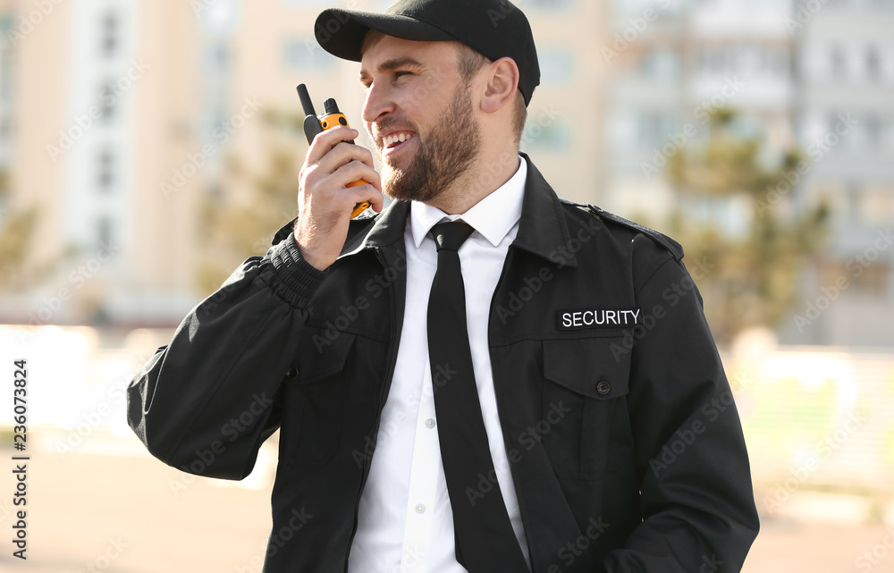 Male security guard with portable radio transmitter outdoors Stock ...