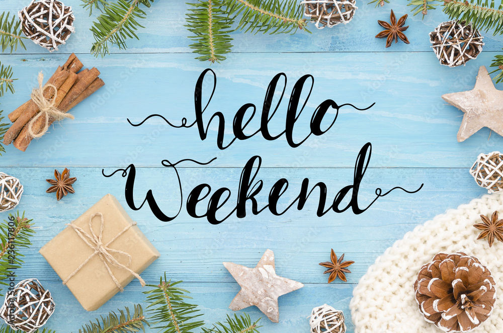 Hello weekend hand lettering on blue wooden background christmas tree ...