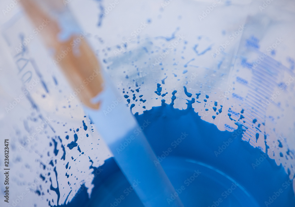 A vibrant large pot of blue mixed acrylic block printing and screen ...