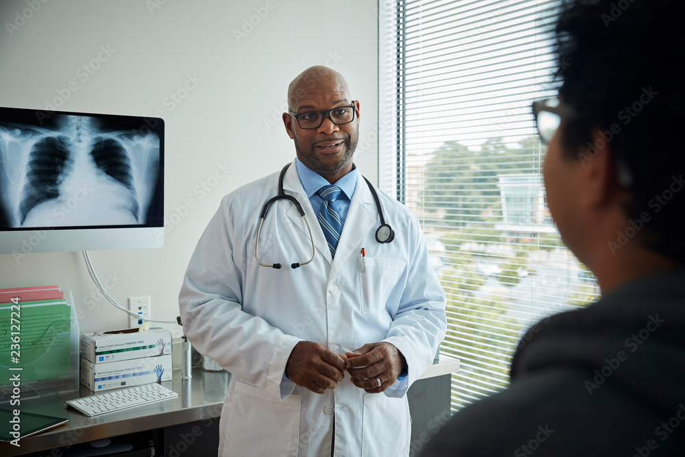 Doctor speaking with patient Stock Photo | Adobe Stock