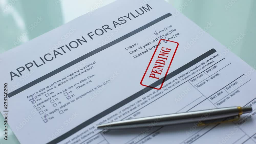 Vidéo Stock Pending application for asylum, hand stamping seal on ...