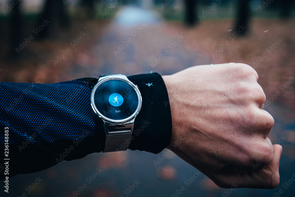 Sport modern watch, icon of running man on display. Stock Photo | Adobe ...
