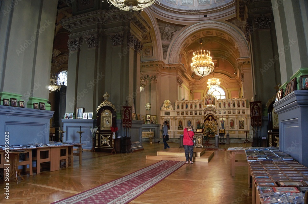 Inside of a large, modern church with pews and cross visible Stock ...
