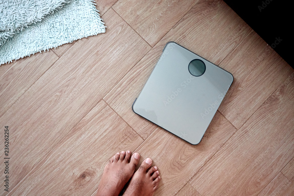 bathroom scale seen in first person man about to weigh himself Stock ...