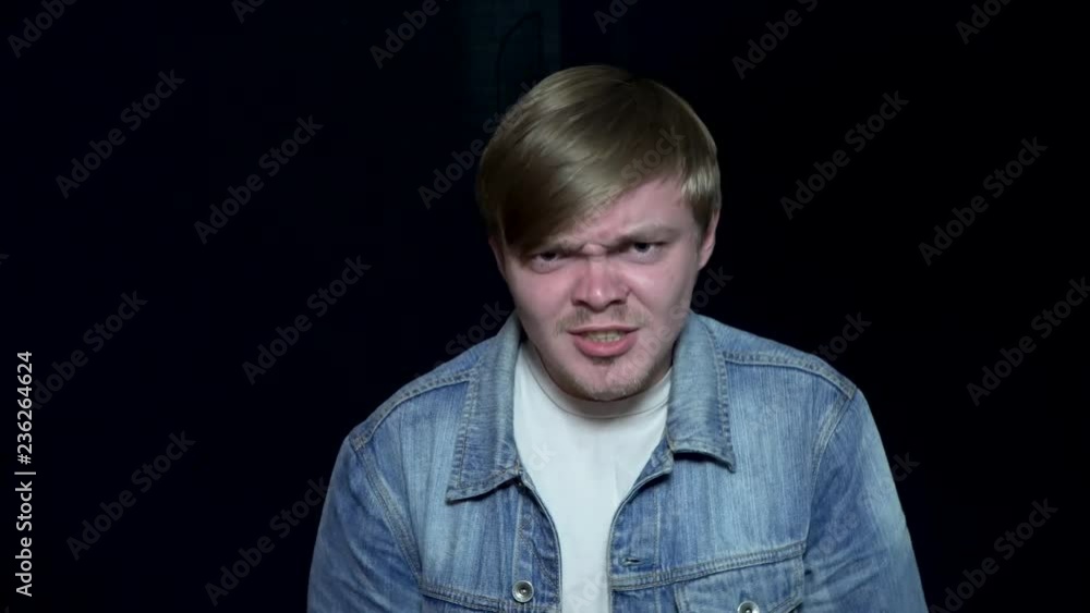 Young growling man. Young man strongly irritated and growling. Human ...