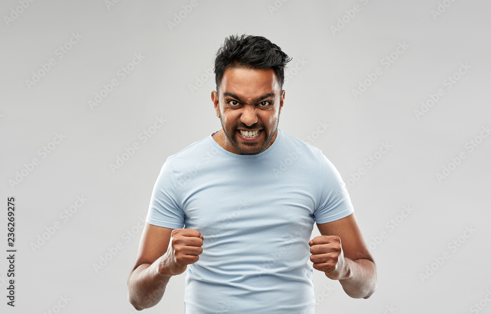 emotion, anger and people concept - angry indian man screaming over ...