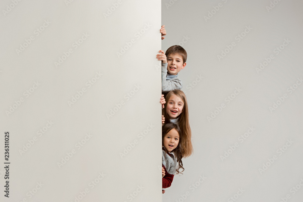 Banner with a surprised children peeking at the edge with copyspace ...