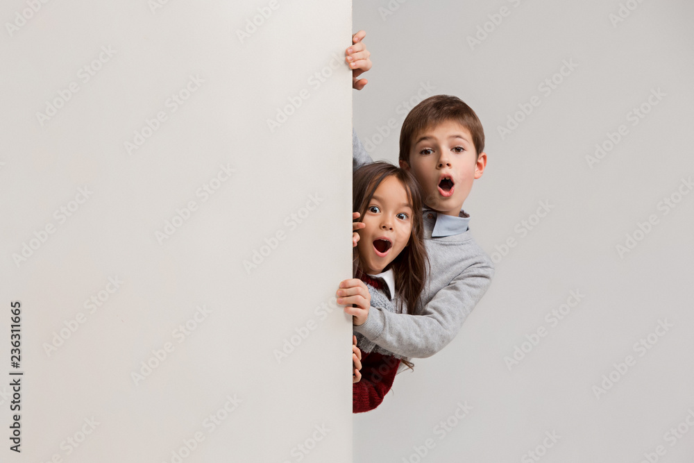 Banner with a surprised children peeking at the edge with copyspace ...