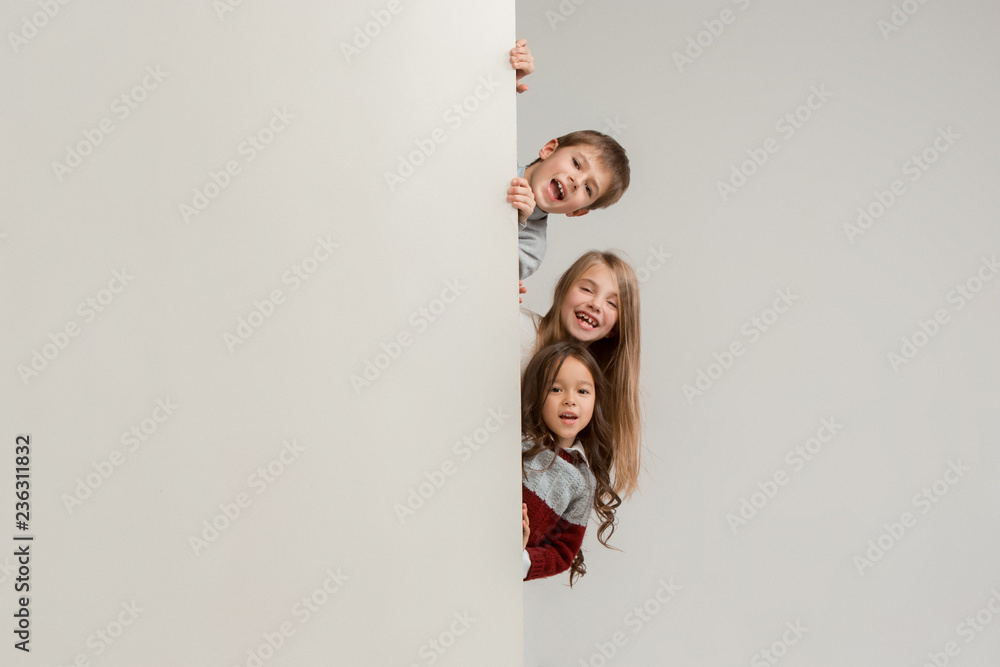Banner with a surprised children peeking at the edge with copyspace ...