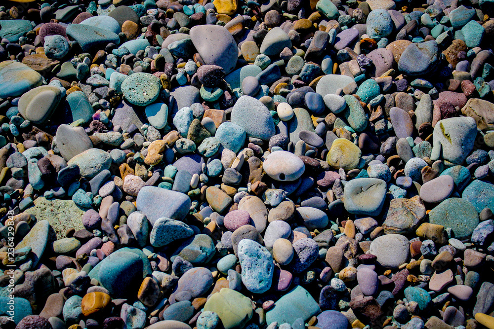 Colorful pebbles and rocks on Pantai Batu Biru, known as Blue Stone ...