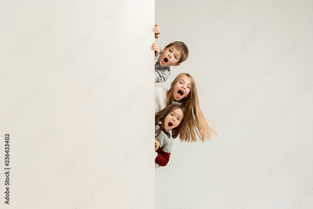 Banner with a surprised children peeking at the edge with copyspace ...