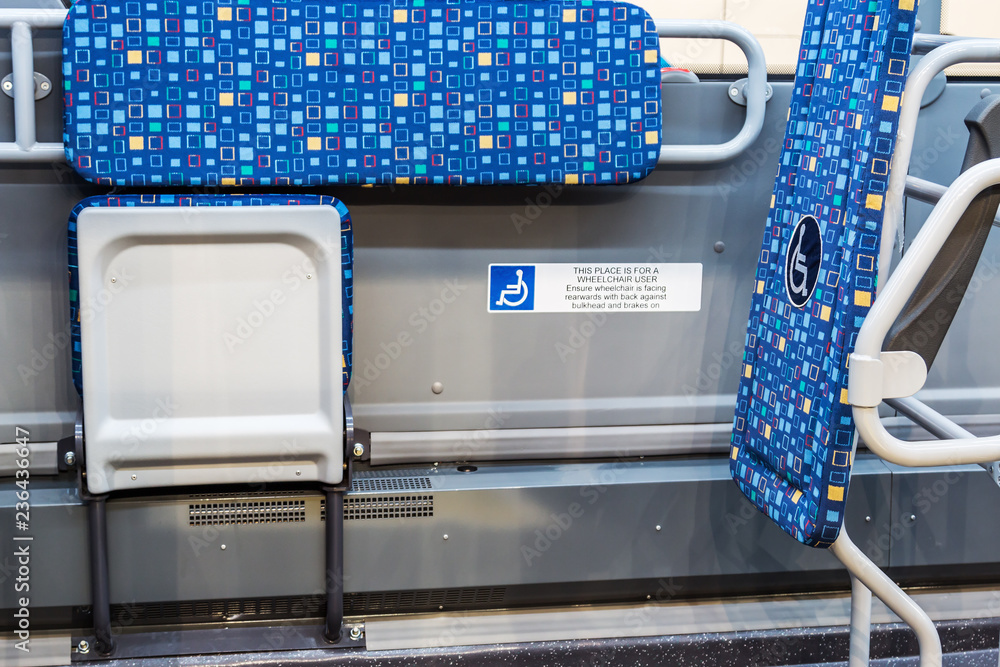 Foto de modern city bus with seats for disabled and elderly people ...