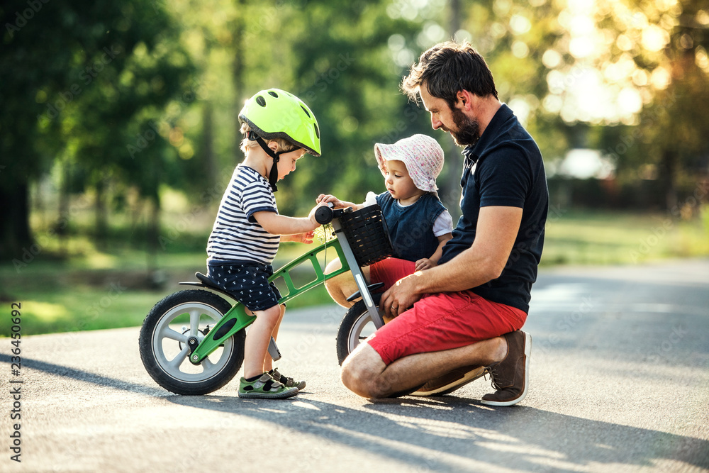 Father playing with children outdoors Stock Photo | Adobe Stock