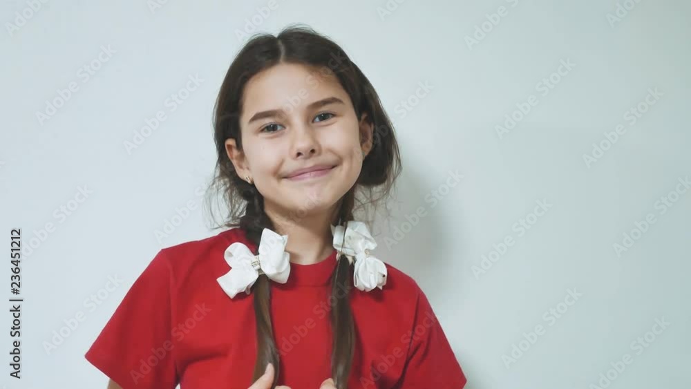 Vidéo Stock Shy little smiling happy girl standing . Cute teenage ...