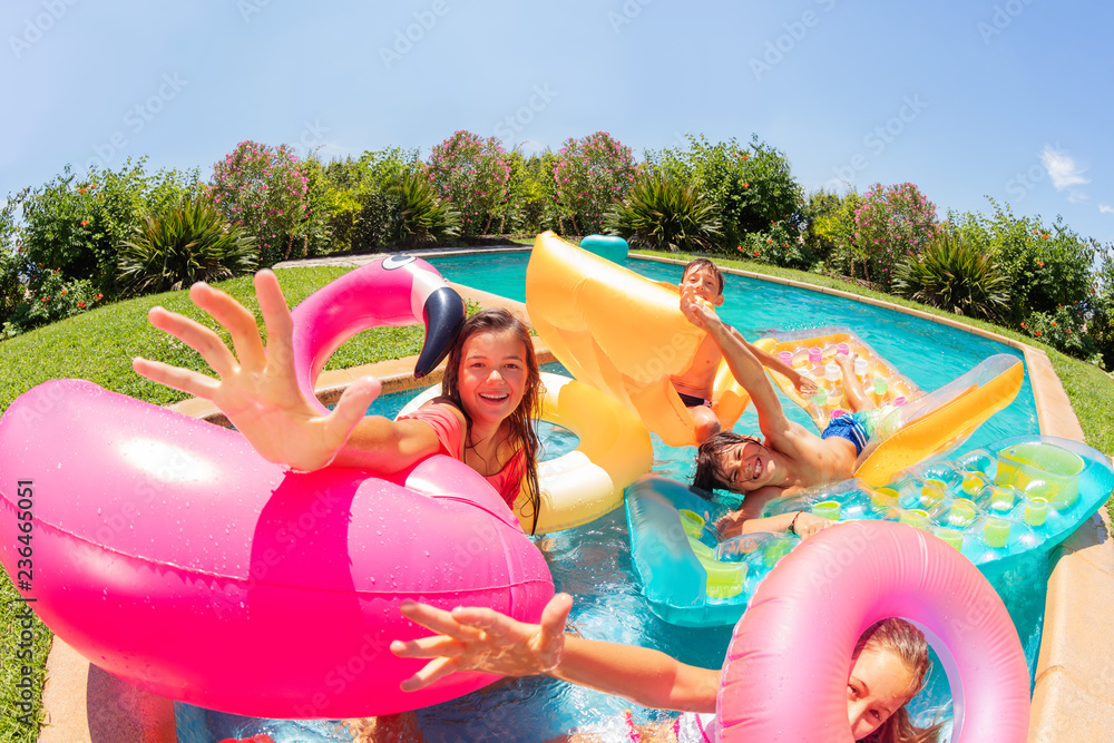 Cute girl having fun with friends in swimming pool Stock Photo | Adobe ...