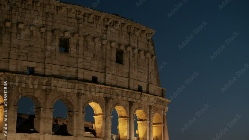 Detailed closeup view of the Roman Colosseum top level pan tilt down to ...