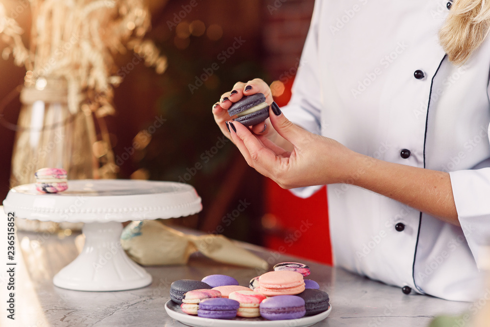 The confectioner joins the parts of the macarons with each other using ...