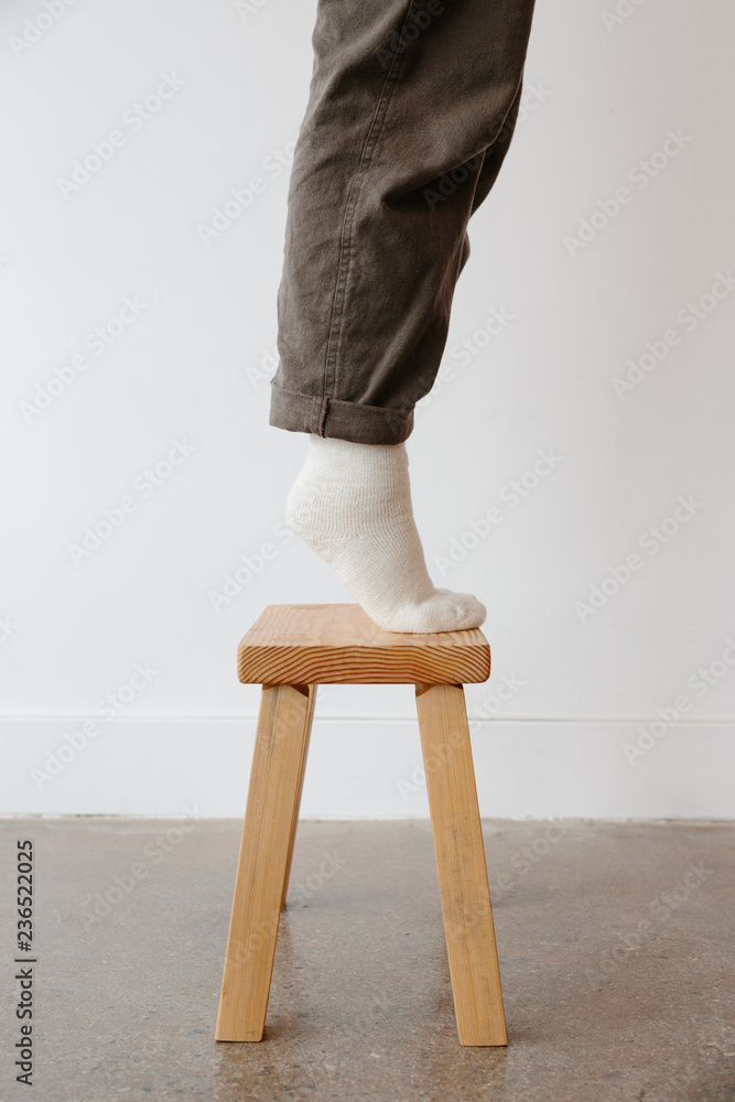 feet on a stool Stock Photo | Adobe Stock