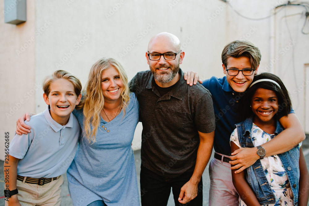 Multi-Race family together in an outdoor, urban setting Stock Photo ...