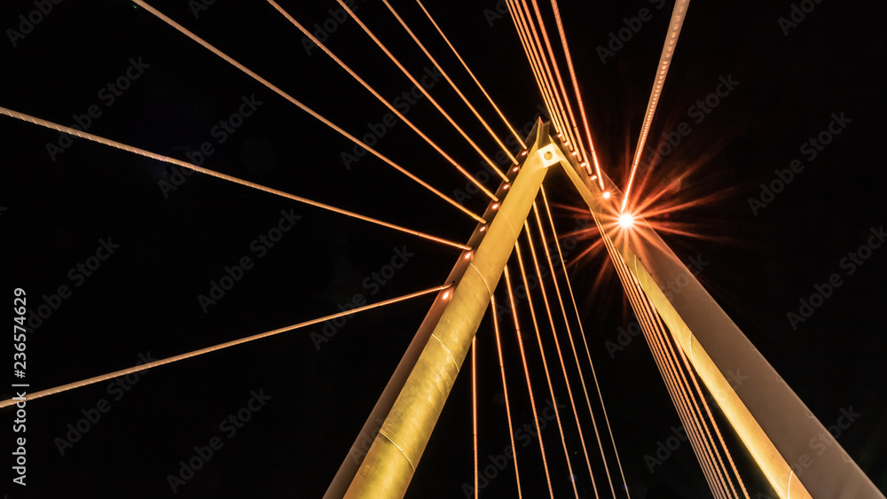 illuminated central pylon of cable suspension bridge Stock Photo ...