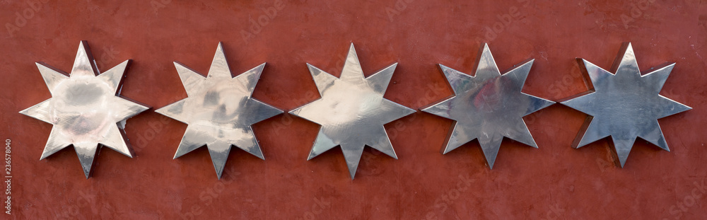 Five silver stars on brown background. The concept of rating. The ...