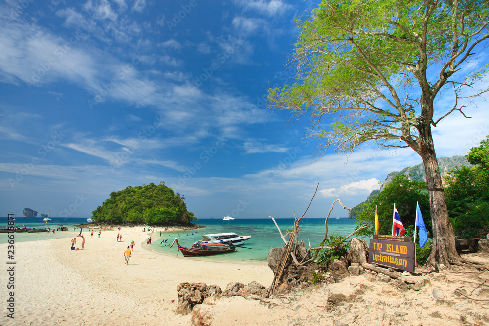 Koh Tub island with people walk on the beach and long tail boat ,blue ...