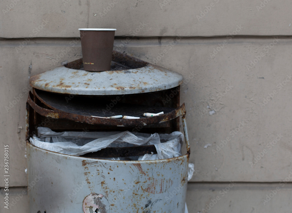 Aged outdoor metal broken grey trash waste bin Stock Photo | Adobe Stock