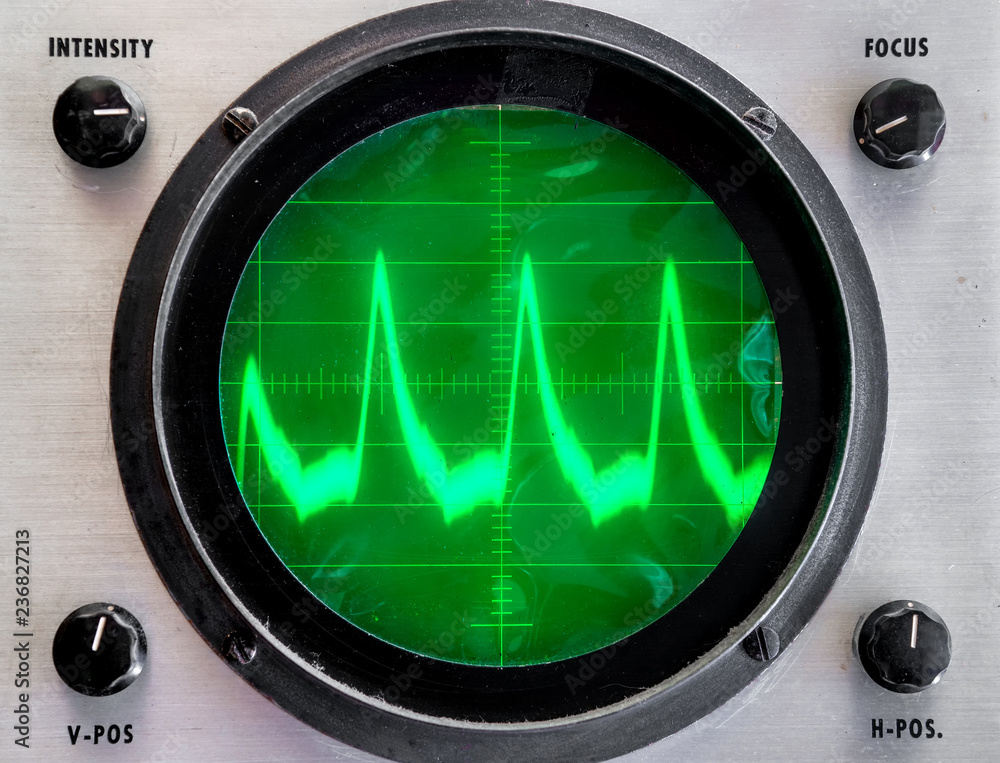 Very old oscilloscope. Round face is green plastic film that is not ...