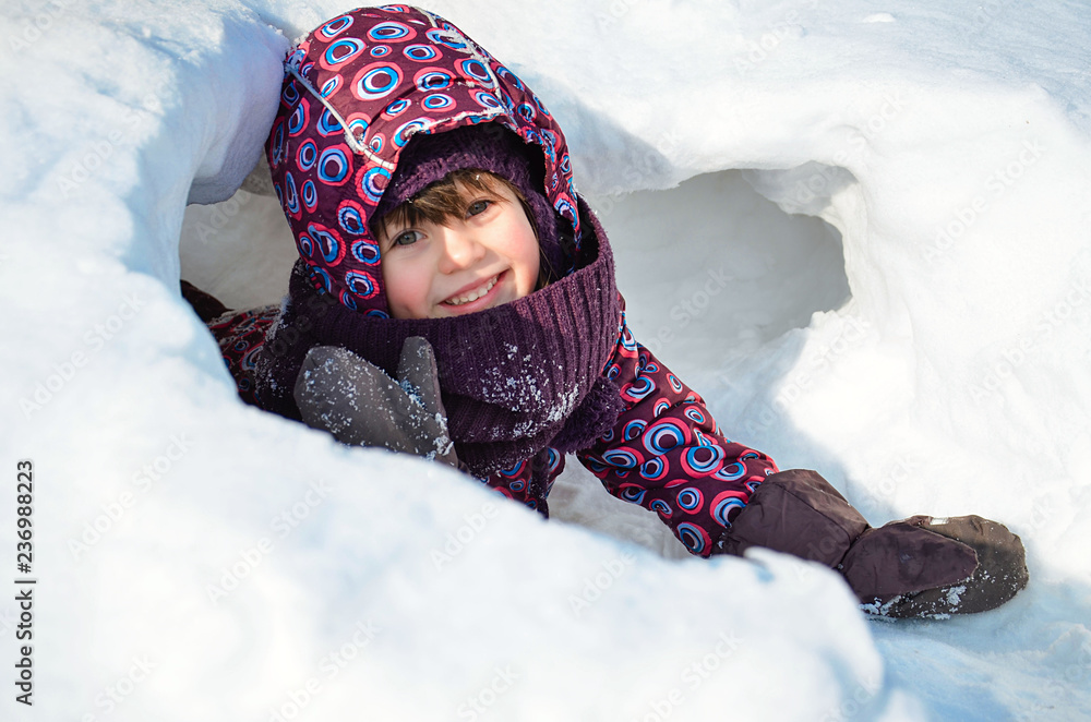 Little cute smiling kid having fun in snow. Happy childhood concept ...