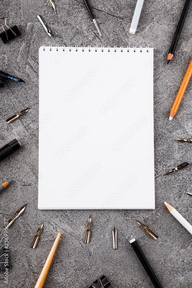 Artist home office desk workspace frame paint brushes and tools on gray ...