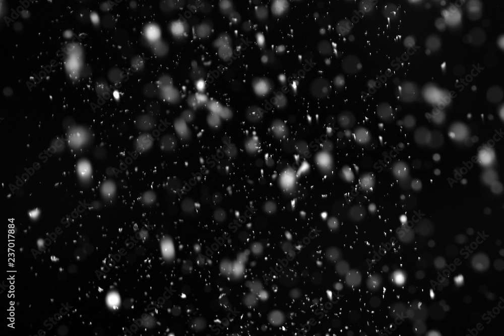Snow flakes falling on black background. Winter weather Stock Photo ...