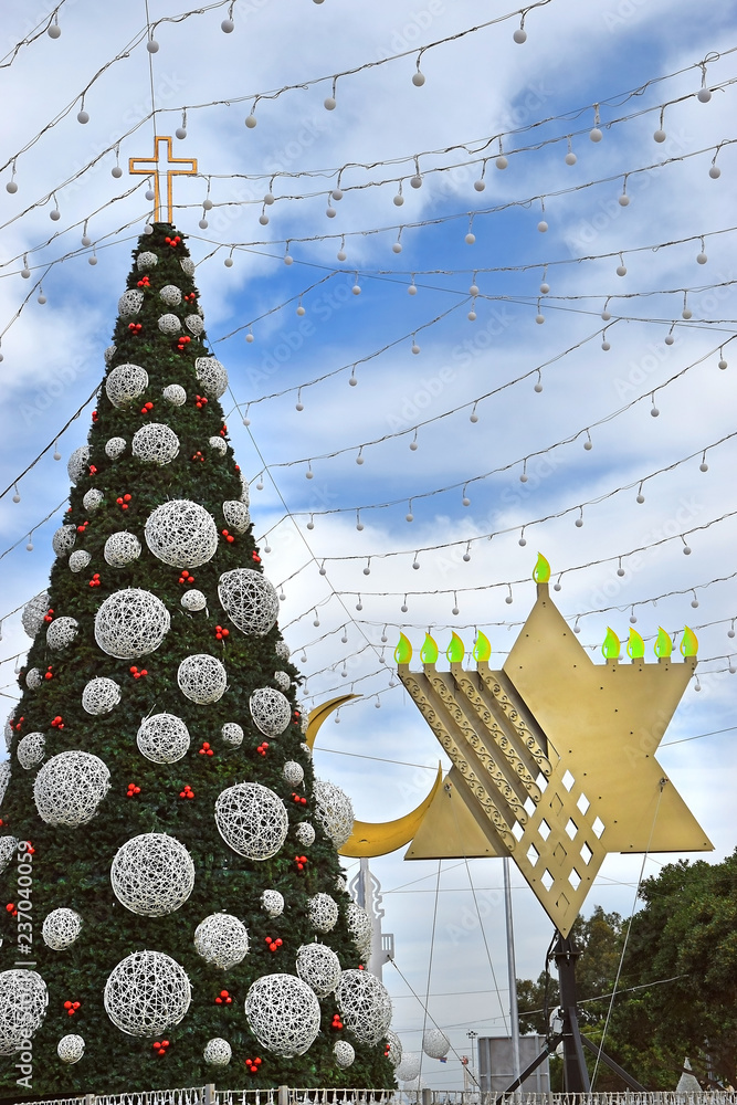 Christmas tree, Hanukkah menorah and crescent in Haifa, Israel Stock ...