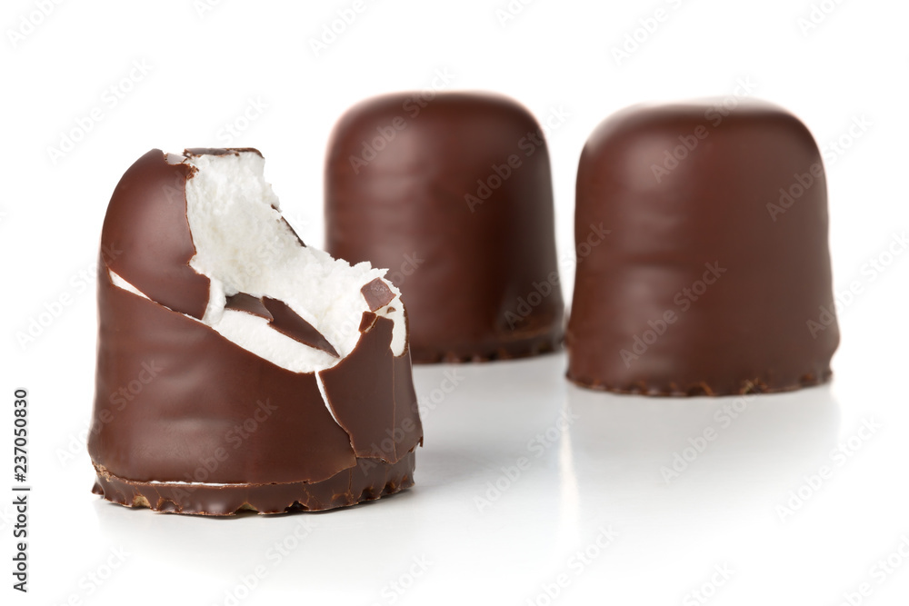 Whole and bitten off german specialty sweet "Schokokuss" or ...