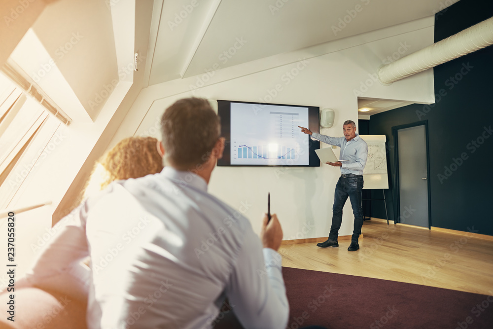 Businesspeople asking questions during an office presentation Stock ...