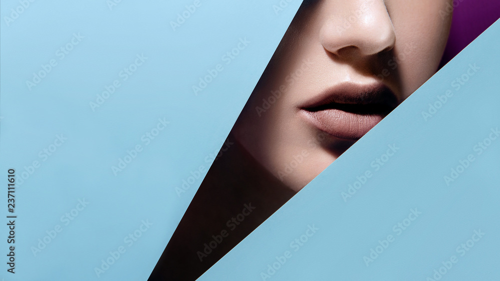 Beautiful plump lips in blue paper frame. Woman face with clear skin ...