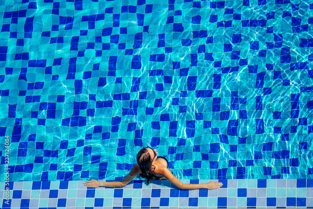 top view resort and spa vacation villa young woman swimming in the pool ...