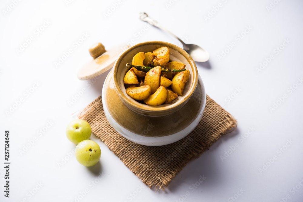 Homemade Gooseberry or amla Pickle/ or Aavle ka Achar in a bowl or ...