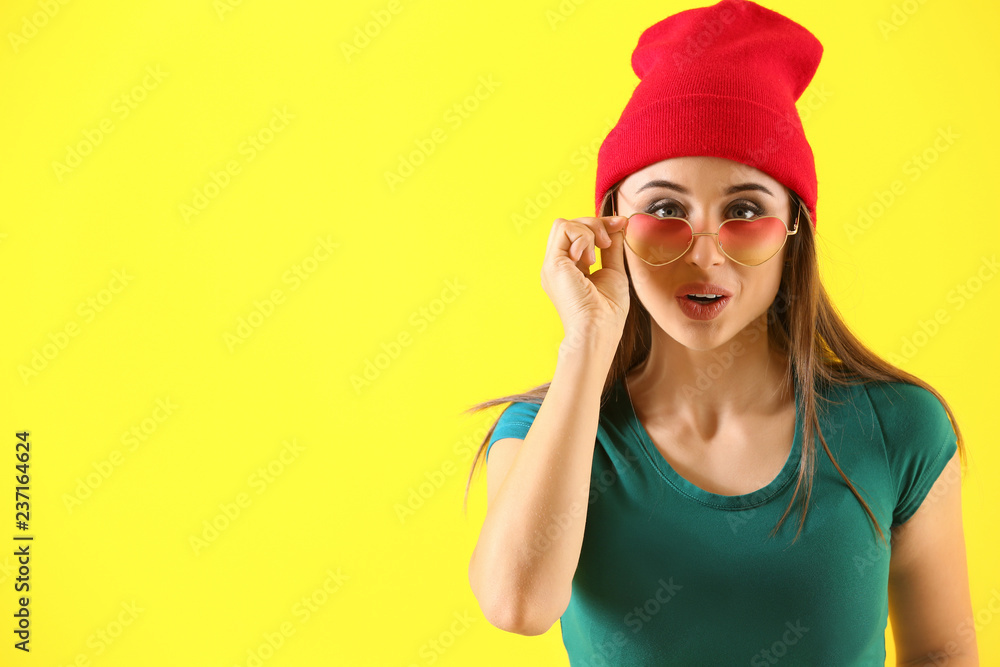 Emotional young woman after making mistake on color background Stock ...