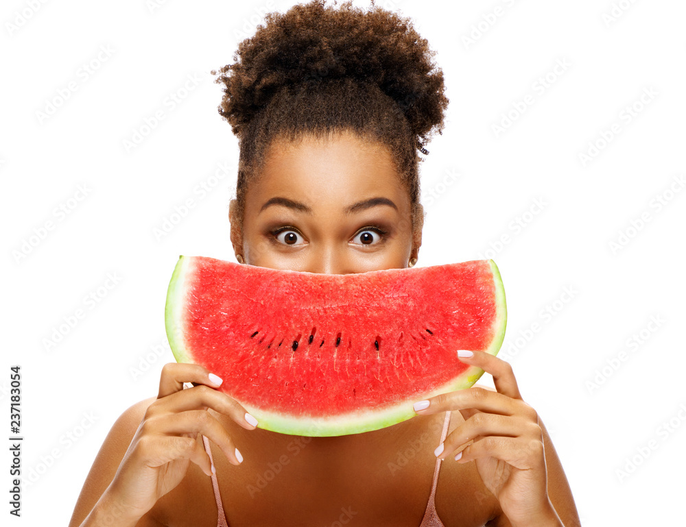 Pretty young girl holding slice of watermelon in front of her face ...