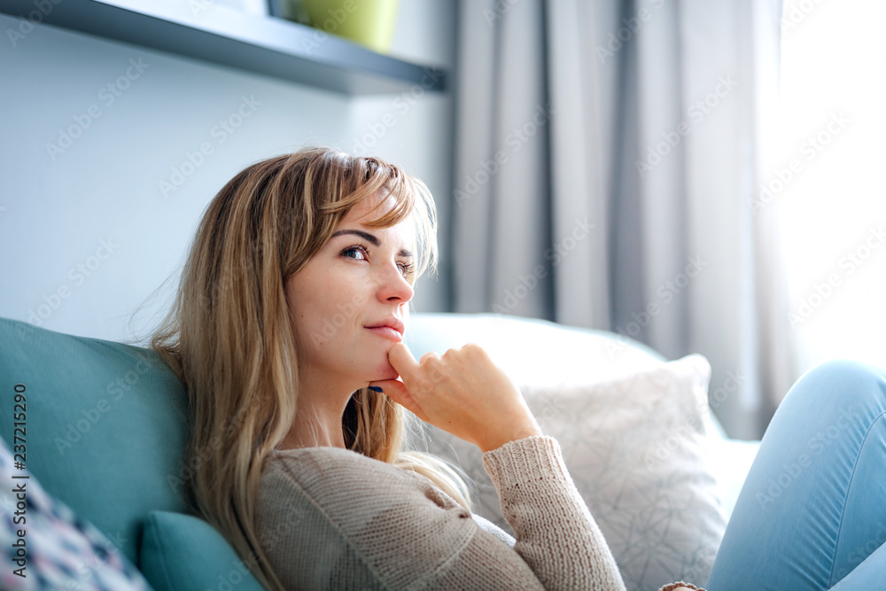 Woman at home deep in thoughts thinking and planning Stock Photo ...
