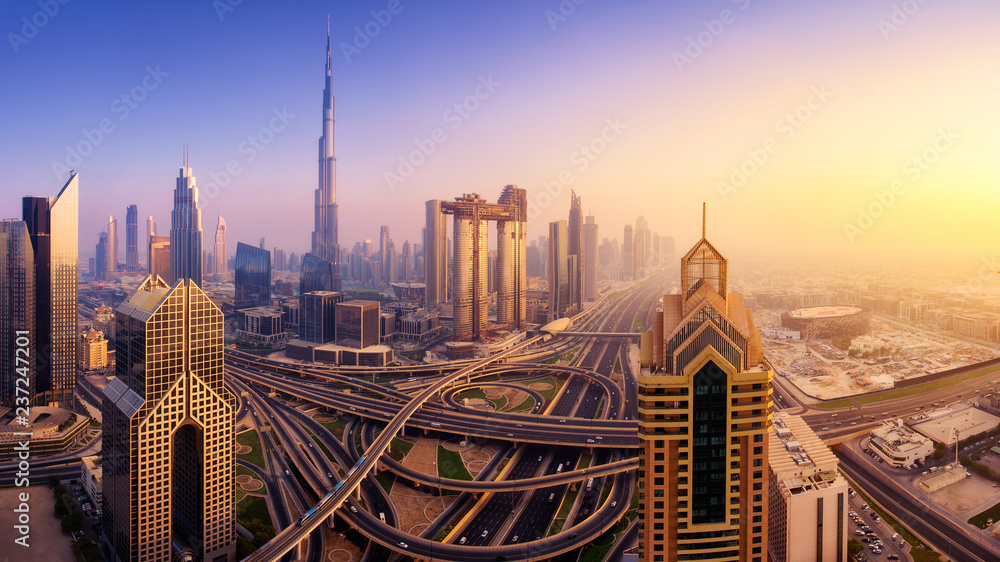 Dubai skyline at sunset, panoramic aerial top view to downtown city ...