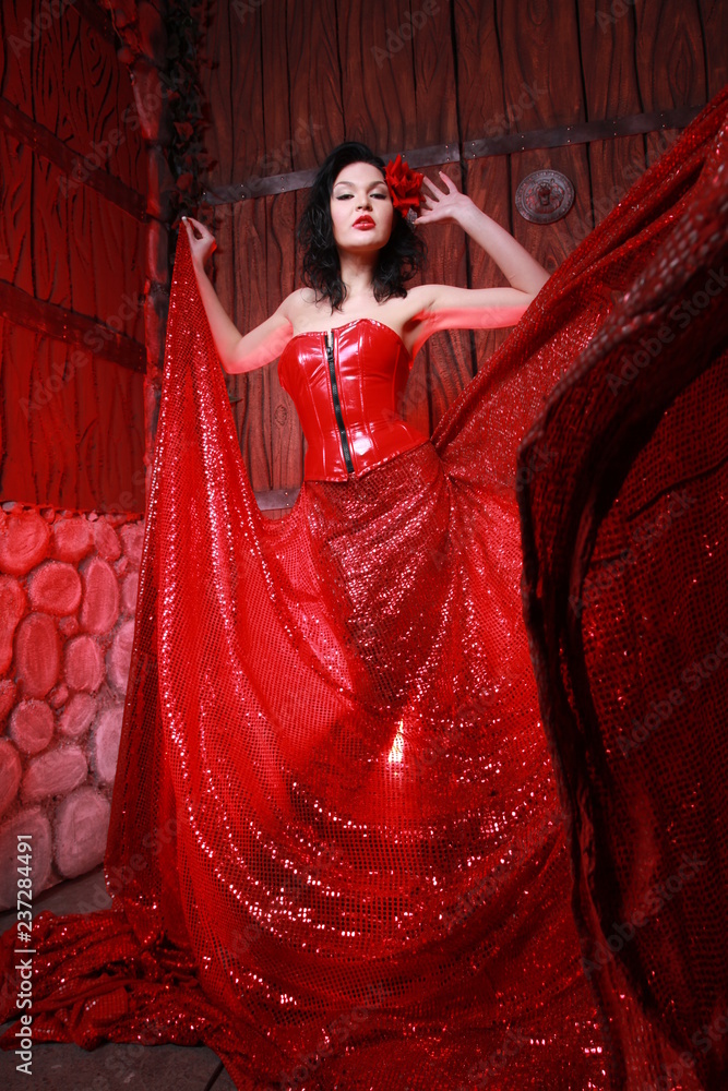 chic girl with black hair decorated by red rose pink as a pin up Gypsy ...