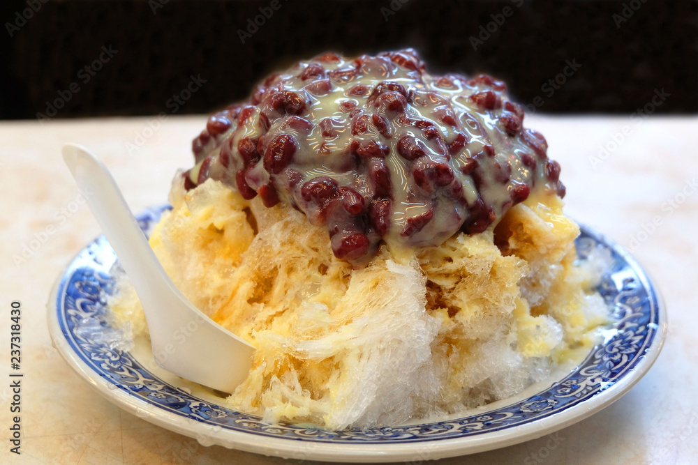 Patbingsu - Korean shave ice with sweetened red beans topping. Stock Photo | Adobe Stock