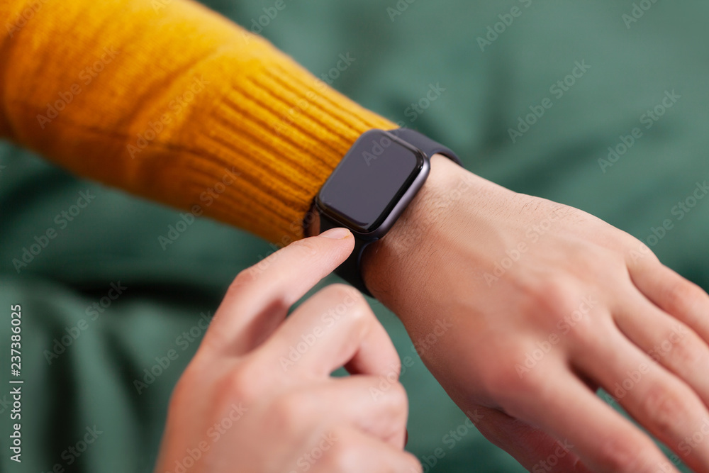 Men's hand touching smart watch on top view. Can be used as mock up ...